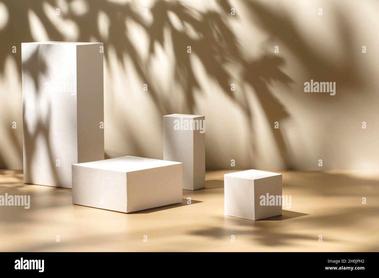 scene with four white podiums on beige background Stock Photo - Alamy