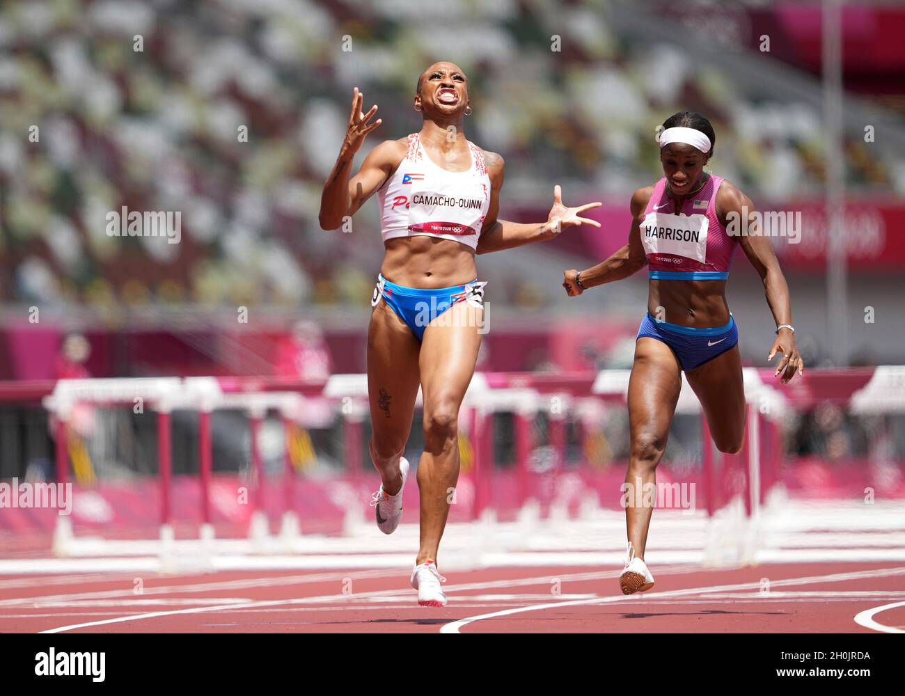Jasmine Camacho-Quinn running and winning in the final of the 100 meter ...
