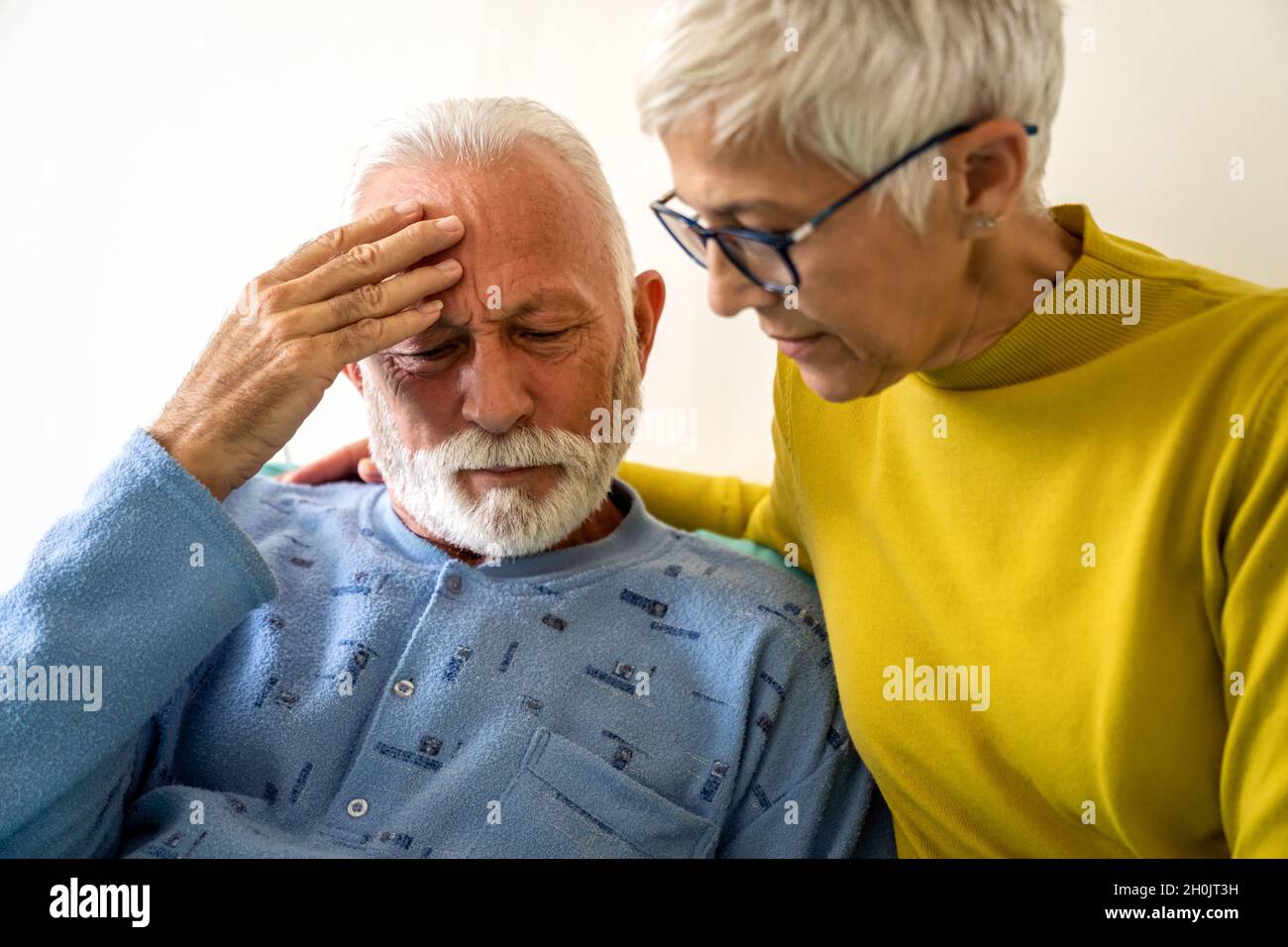 Senior woman with seriously ill husband in hospital. Healthcare support ...