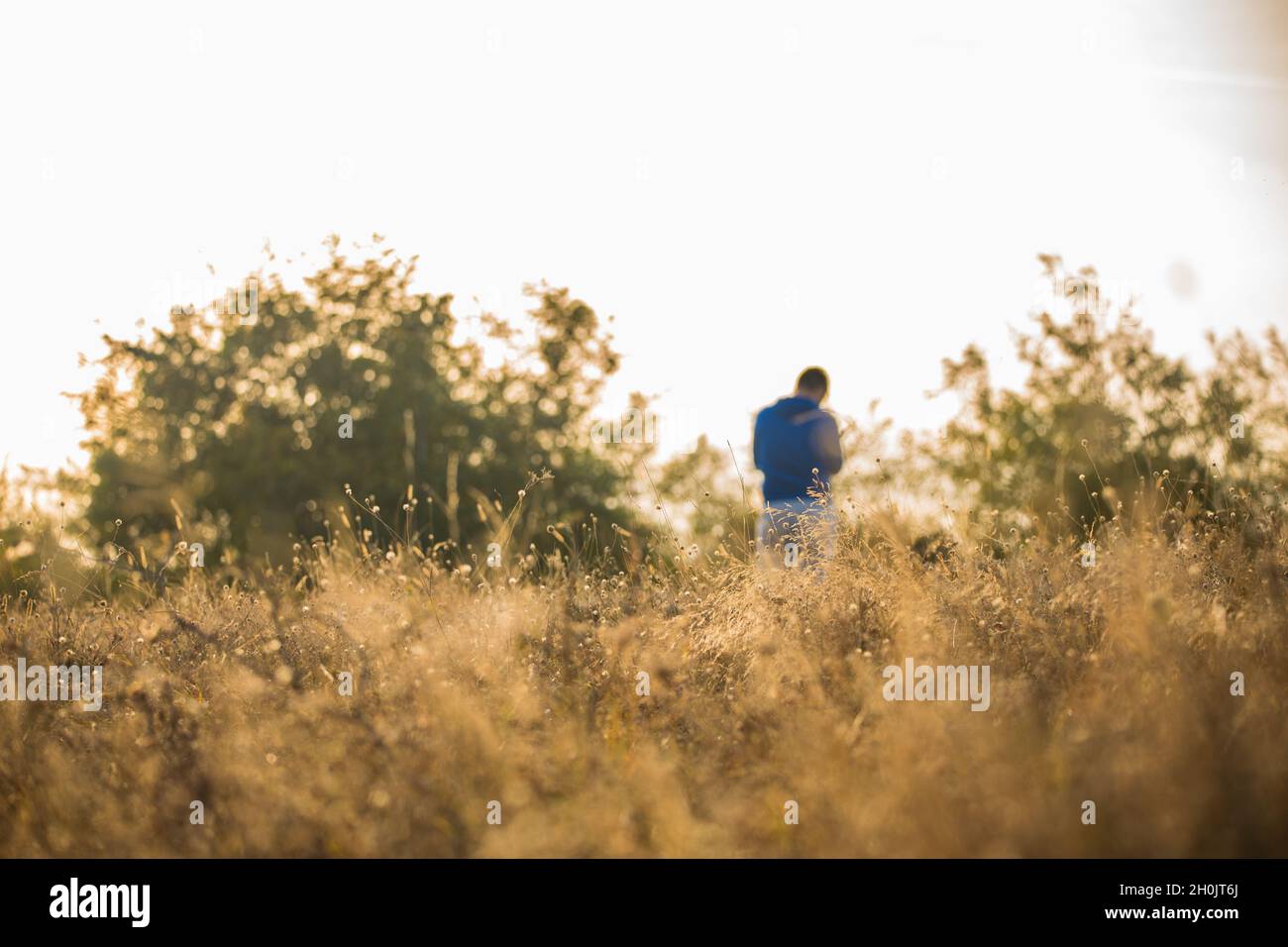 Man silhouette hands raised in hi-res stock photography and images - Alamy