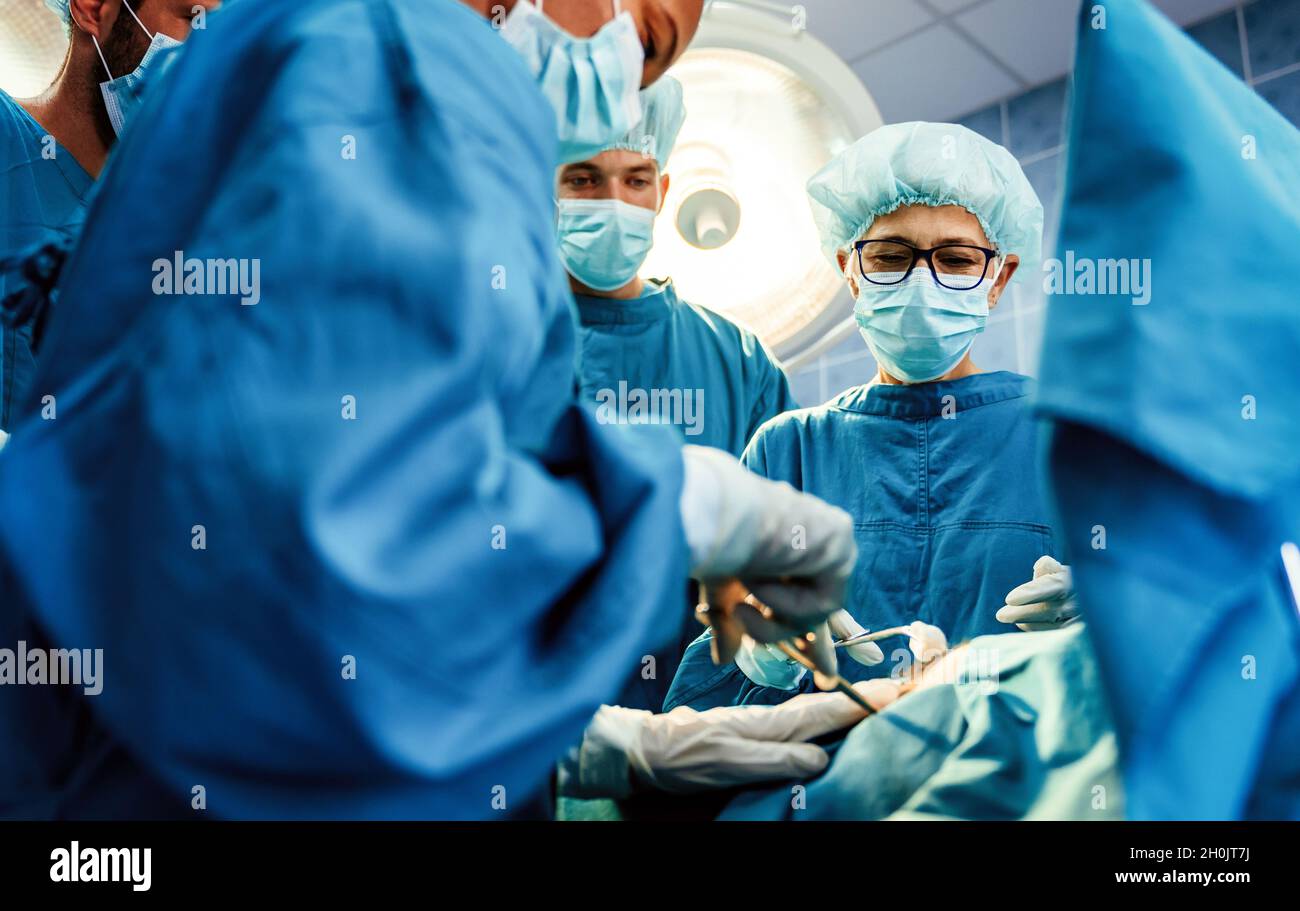 Team of surgeon at work in operating room. Healthcare, hospital concept ...