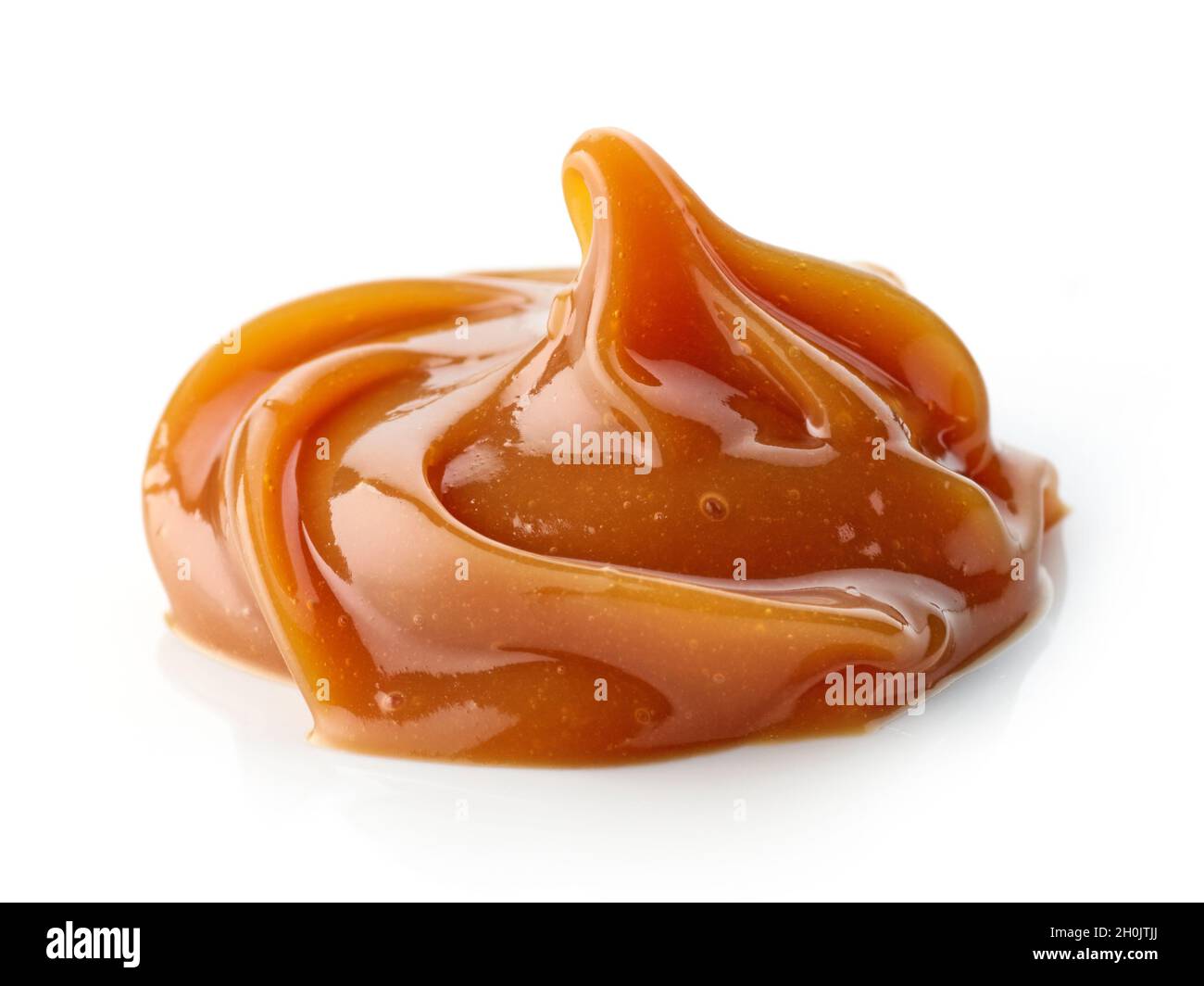 melted caramel isolated on white background Stock Photo - Alamy