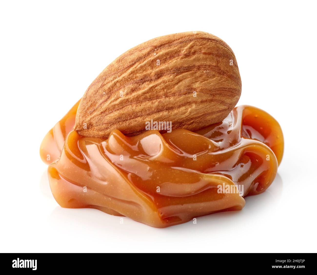 almond in melted caramel isolated on white background Stock Photo - Alamy