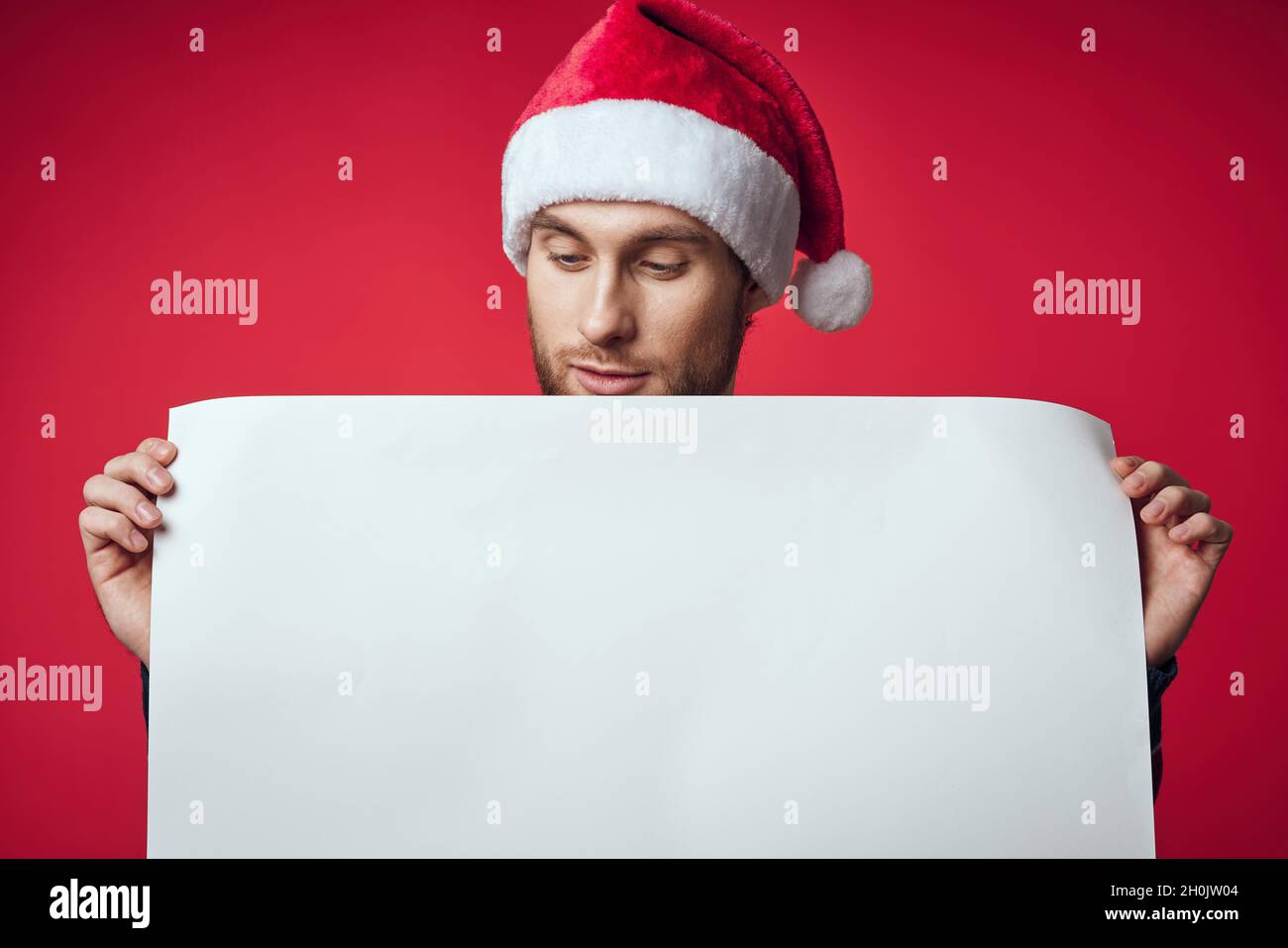 Cheerful man in a christmas white mockup poster studio posing Stock ...