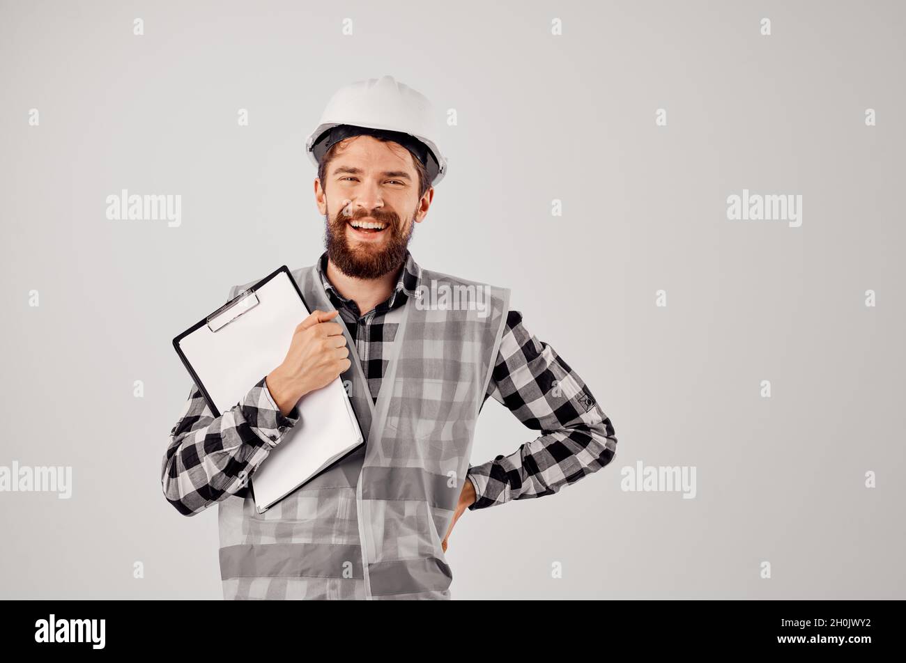engineer in a white helmet blueprints Professional light background ...