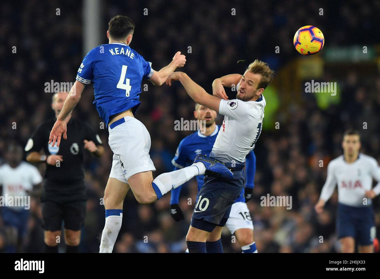 Tottenham Hotspur's Harry Kane and Everton's Michael Keane compete for ...