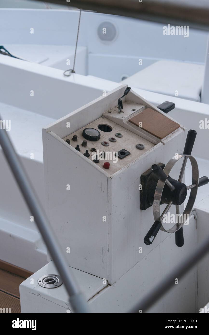 Steering position with steering wheel of small white fishing boat Stock ...