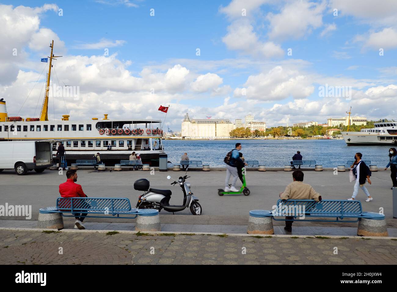 Istanbul, Turkey - October 4, 2021 : Two men are sitting on benches ...