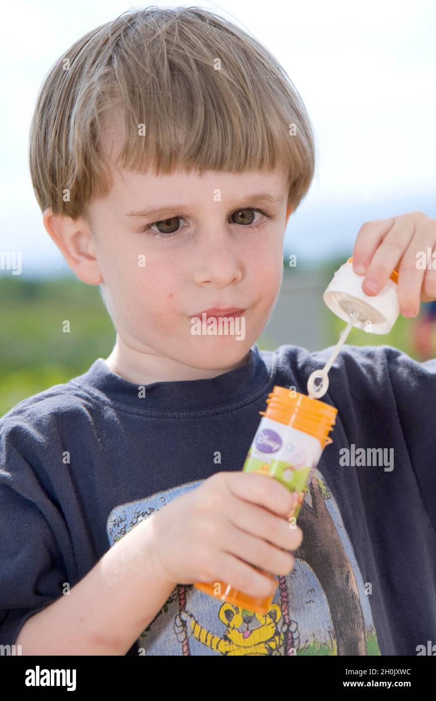 little boy making soap bubbles Stock Photo - Alamy
