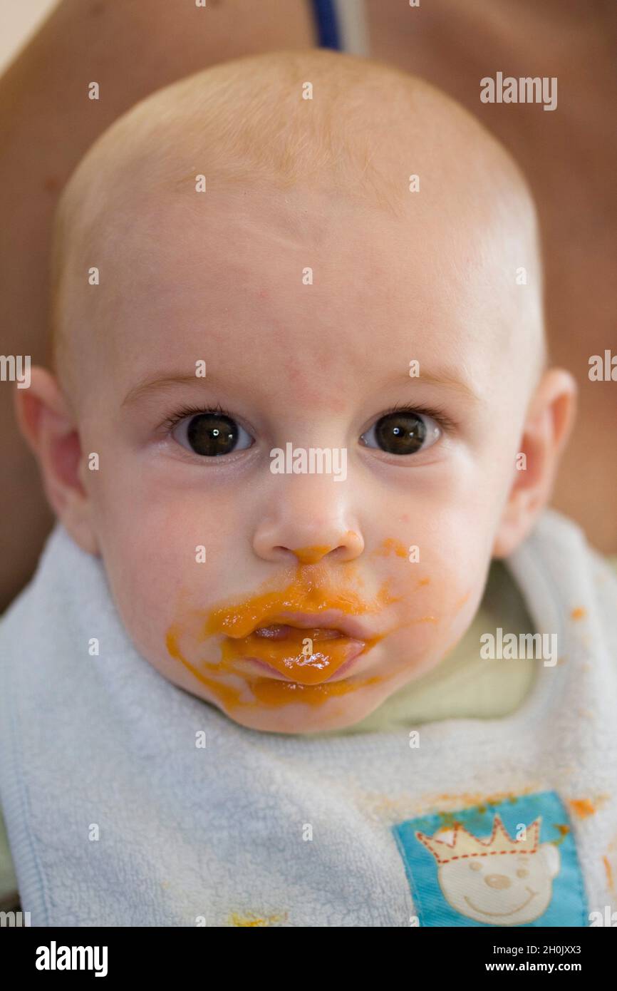 Baby eating carrot hi-res stock photography and images - Alamy