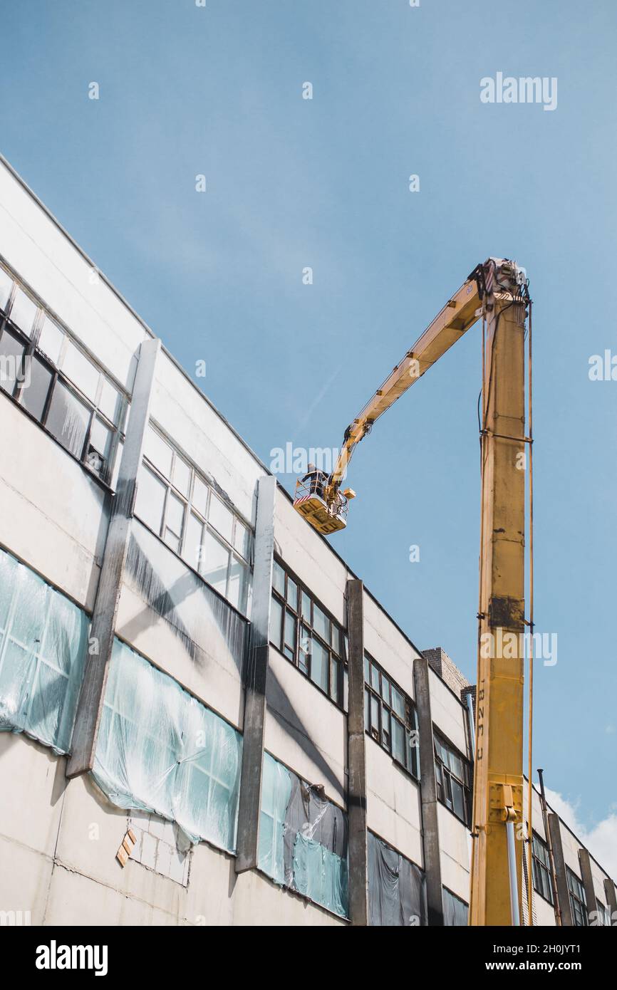 View of the work of a painter and graffiti artist from a crane lifting ...