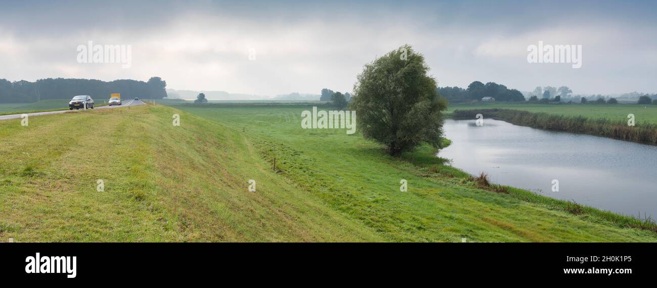 canal in polder and dike between dutch cities zwolle and deventer near ...