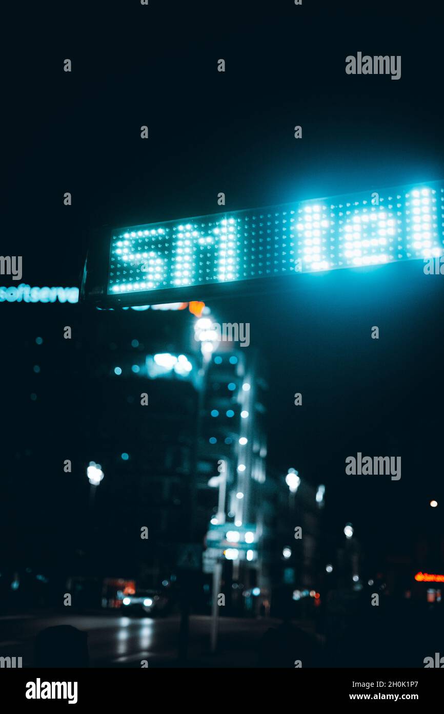 Night cityscape with blue neon billboard Stock Photo - Alamy