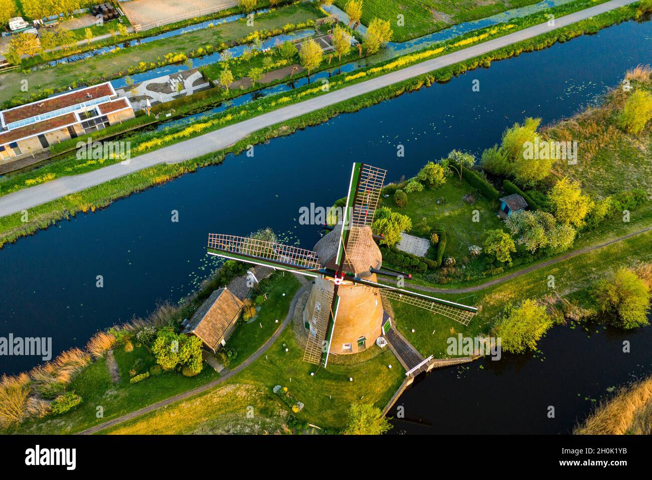 Aerial view of windmills in the Kinderdijk area during sunset. Spring ...