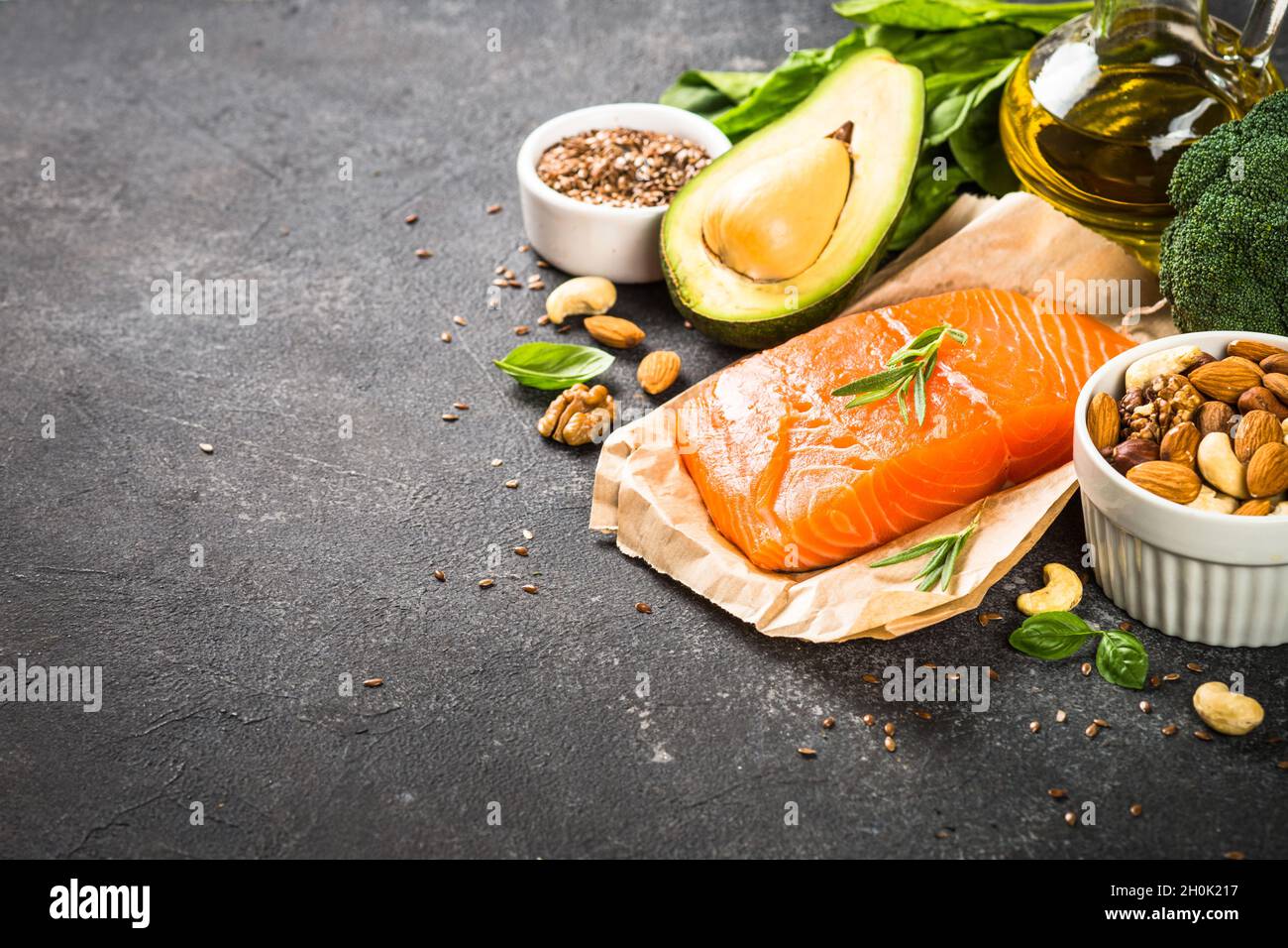 Healthy fats products at black background Stock Photo - Alamy