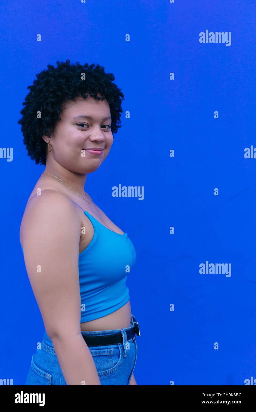 Happy latin person side view hi-res stock photography and images - Alamy