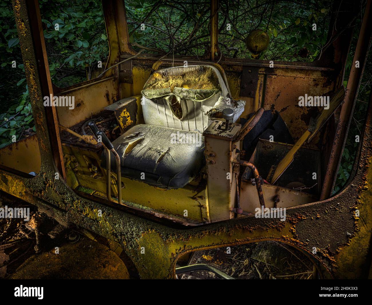 Torn seat inside rusty abandoned bulldozer Stock Photo - Alamy