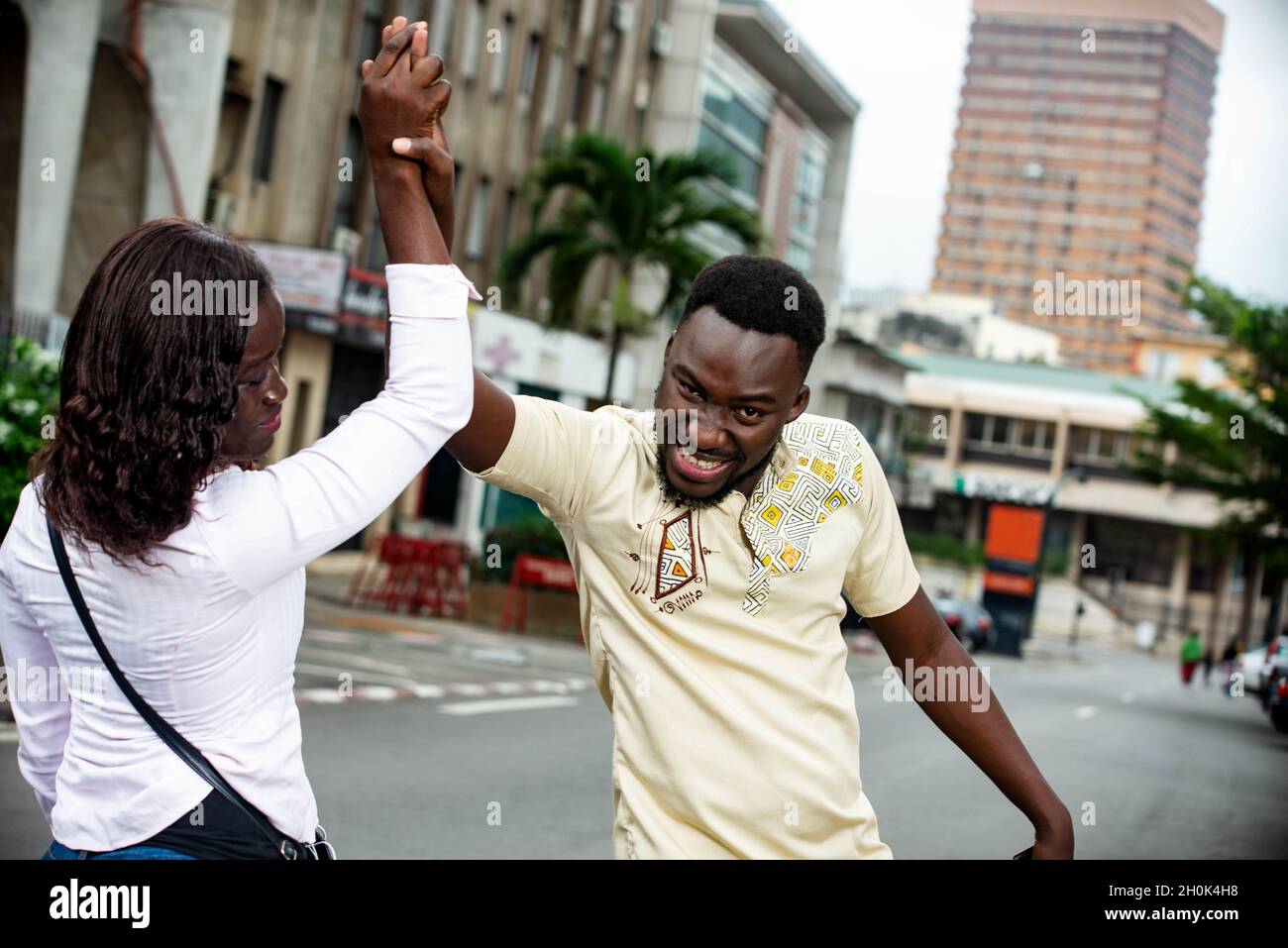young people standing outdoors laughing in hand laughing Stock Photo ...