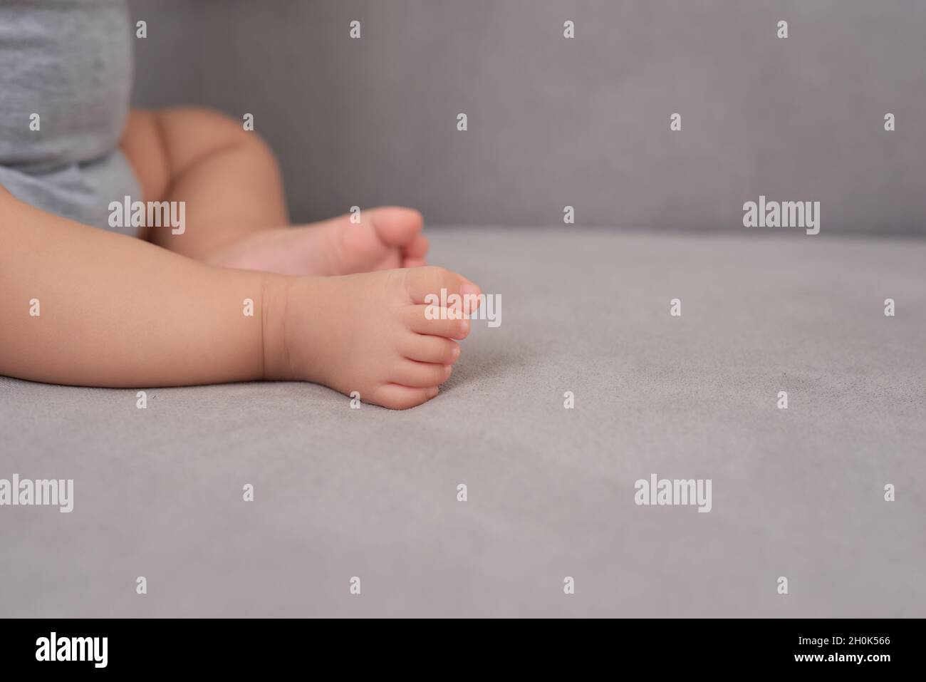 baby toddler legs on couch Stock Photo - Alamy