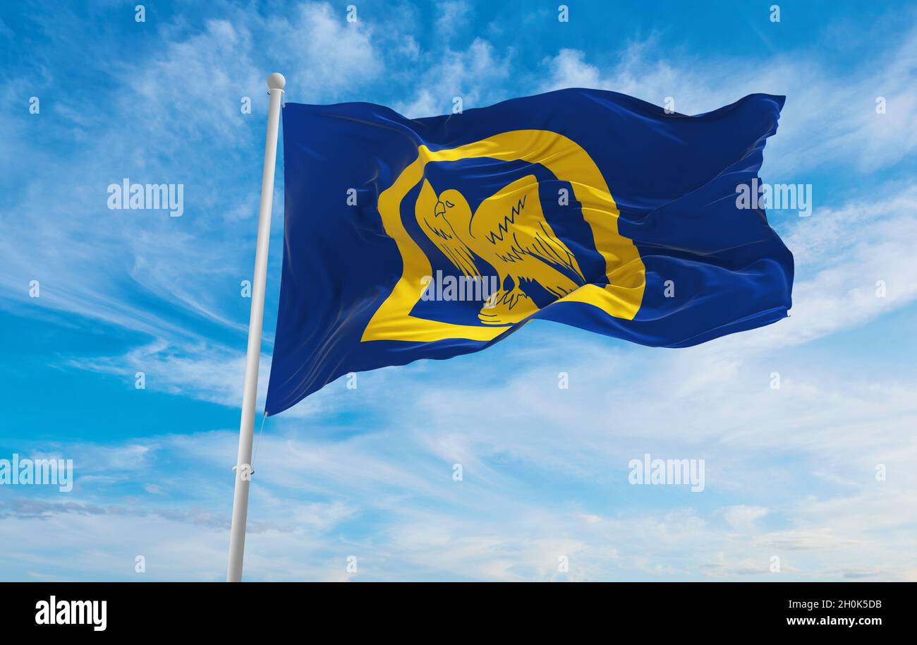 flag of Wing village at cloudy sky background on sunset. panoramic view ...