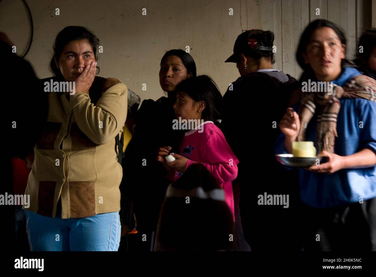 Survivors of a devastating volcanic eruption, at a shelter, in ...