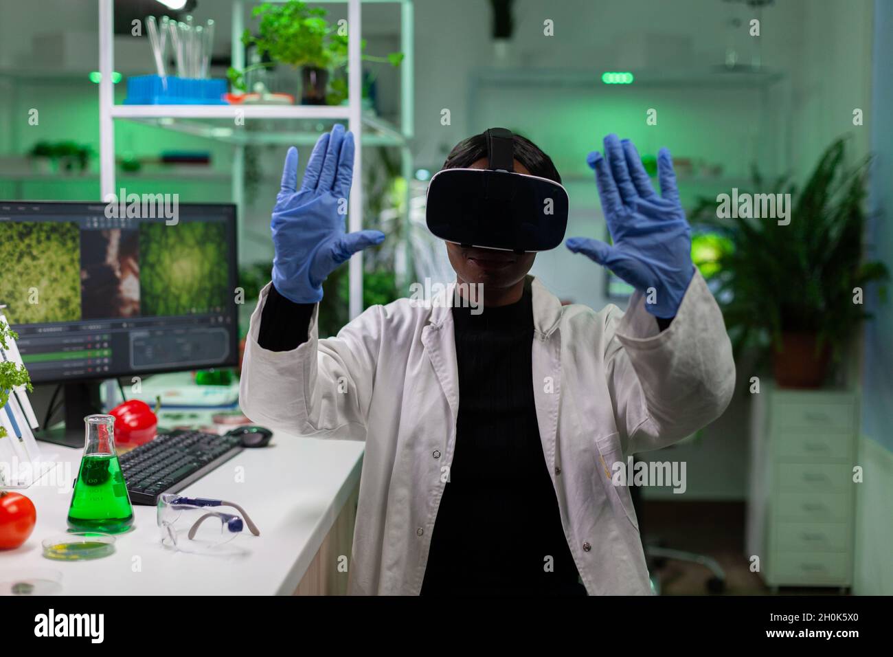 African american scientist woman wearing virtual reality headphones ...