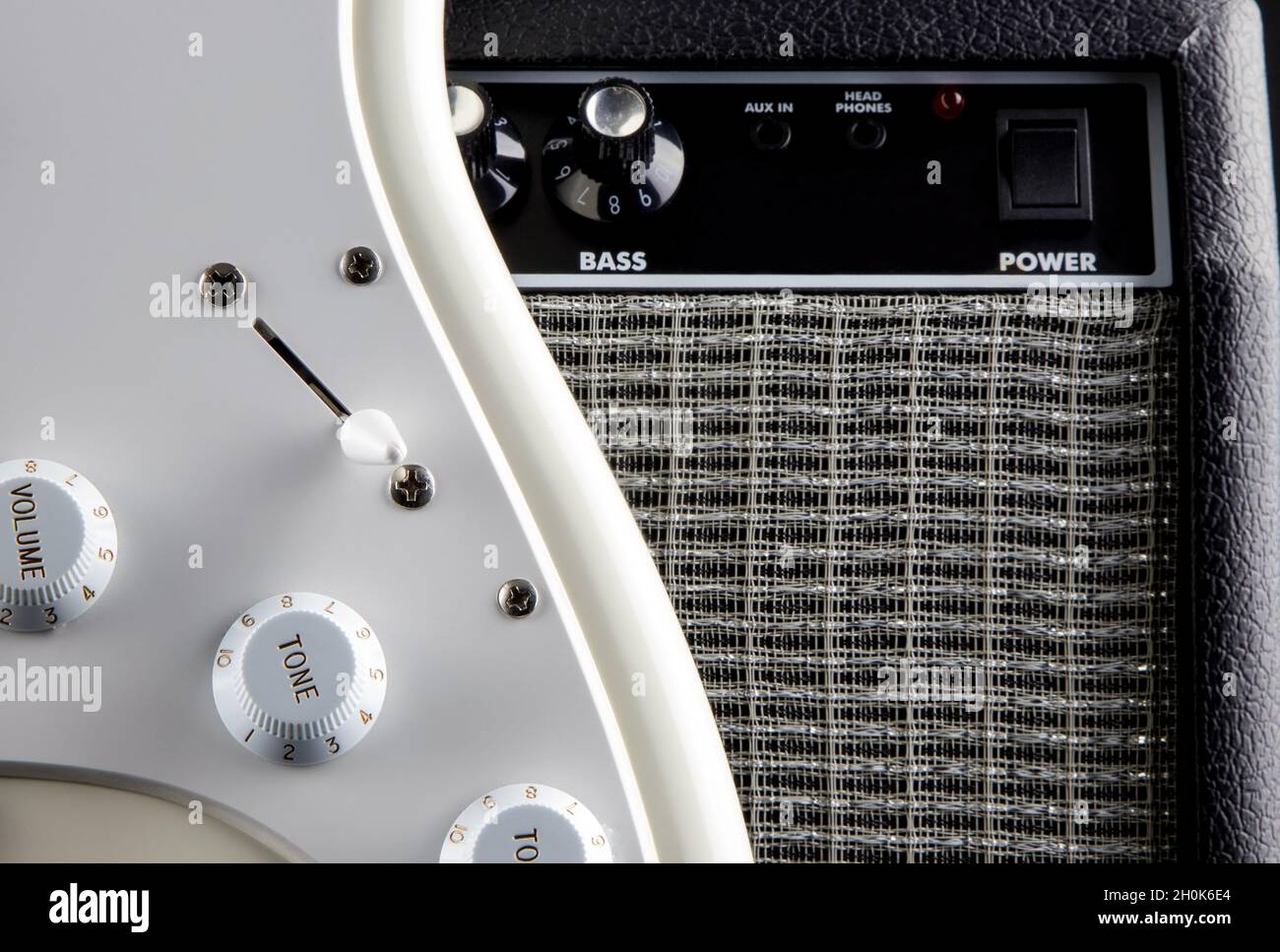 Closeup view of white electric guitar and amplifier Stock Photo - Alamy