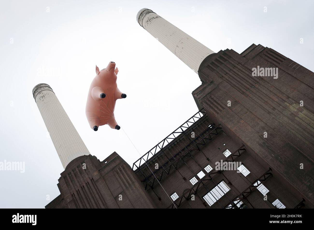 A giant inflatable pig flies above Battersea Power Station on the banks ...