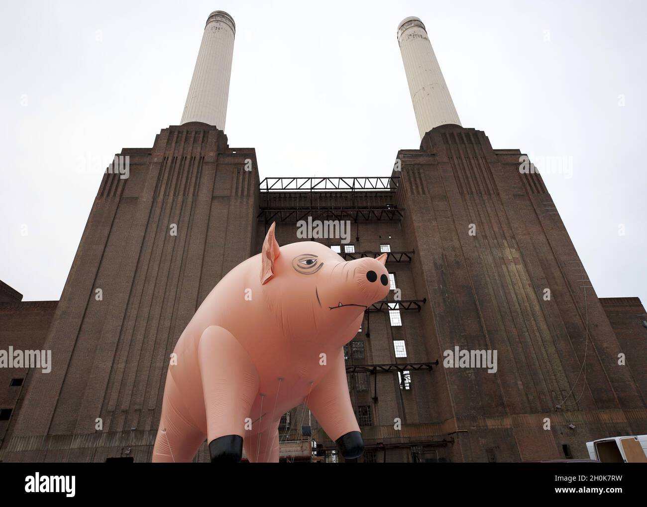 A giant inflatable pig flies above Battersea Power Station on the banks ...