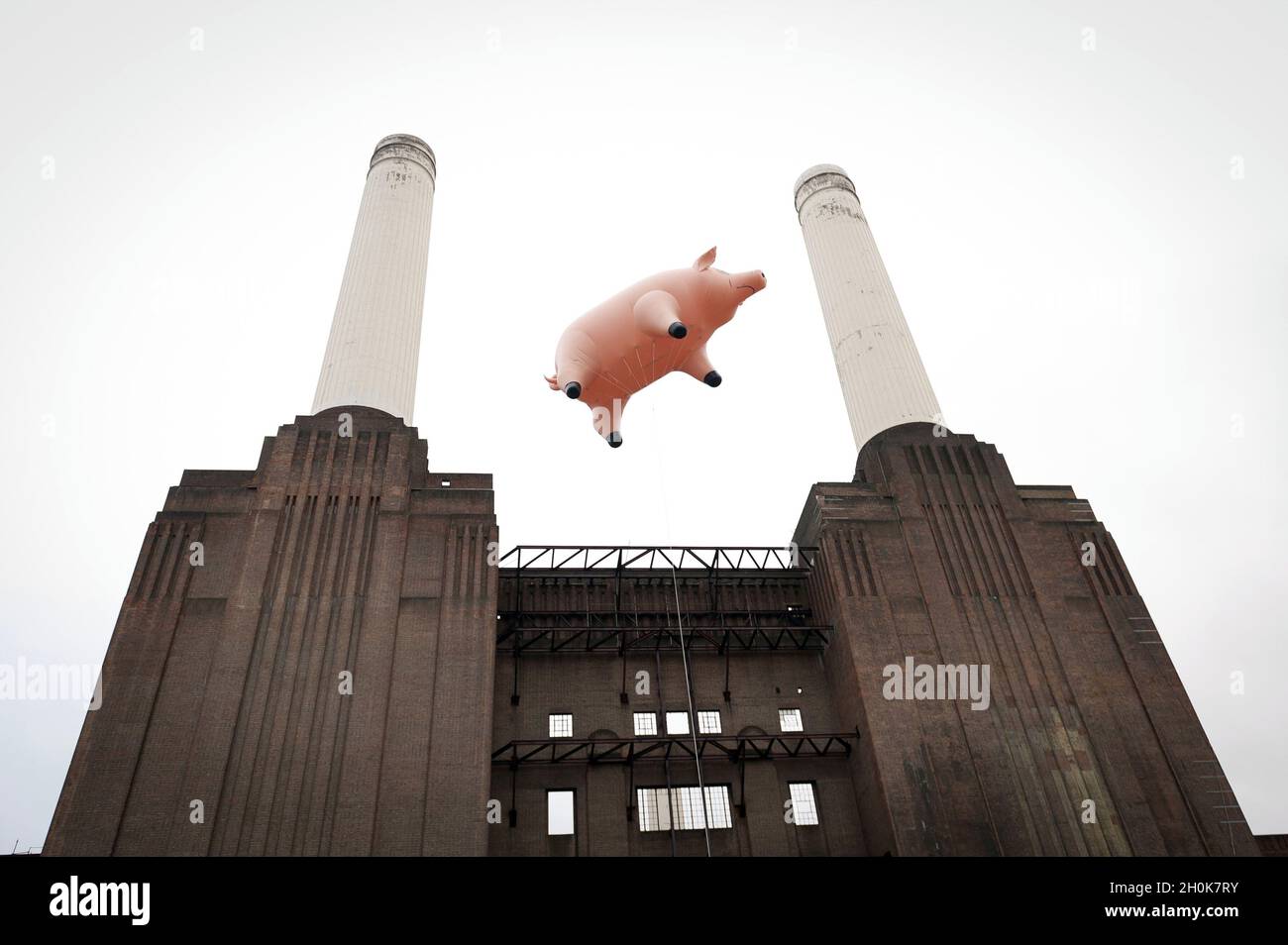 A giant inflatable pig flies above Battersea Power Station on the banks ...