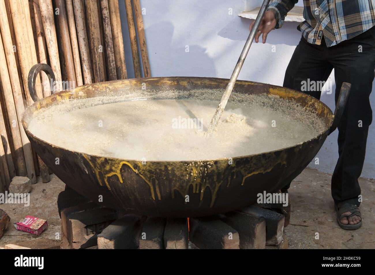 An Indian man cooking millet in Neemrana, India Stock Photo - Alamy