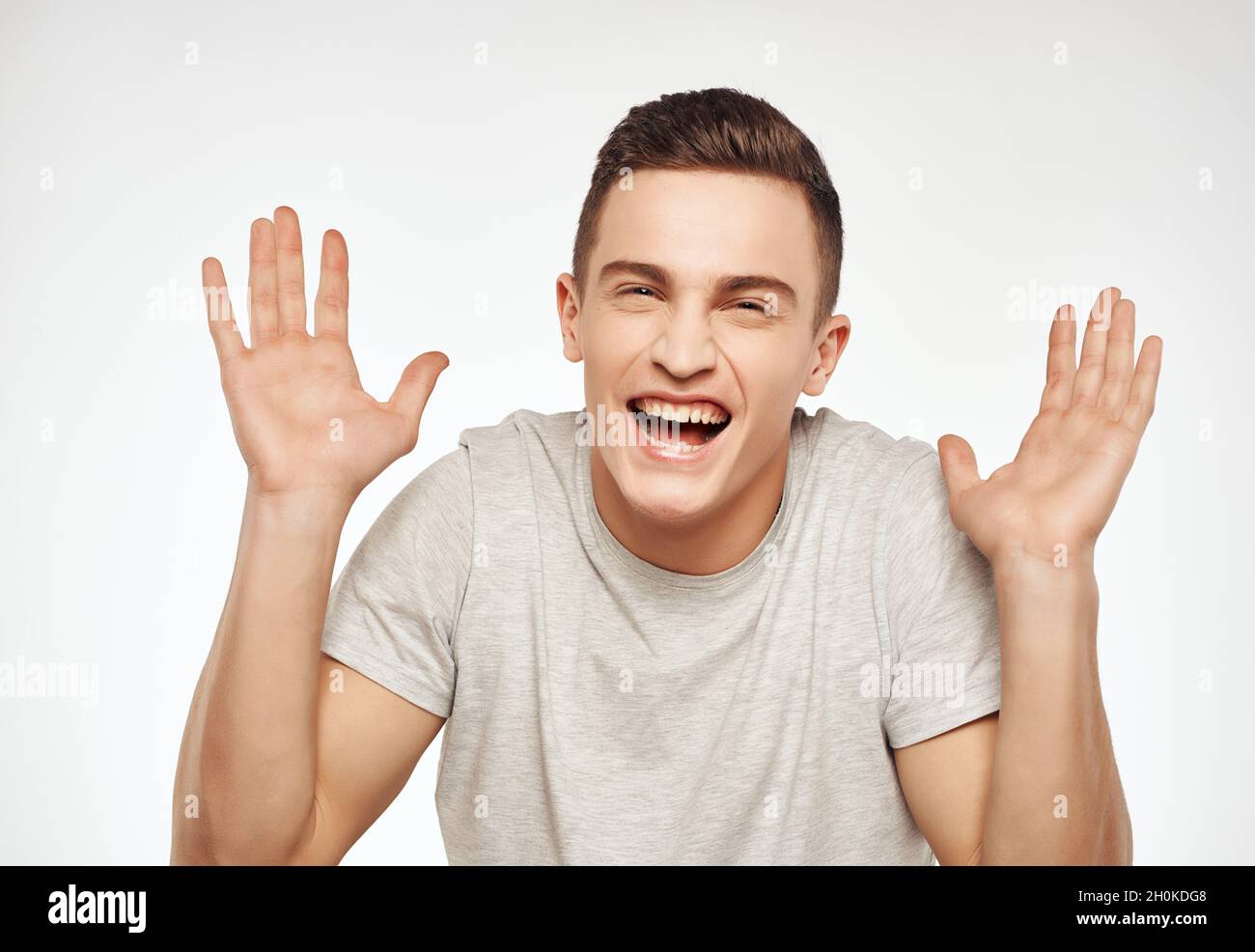 emotional man in white t-shirt hand gestures fun fashion Stock Photo ...