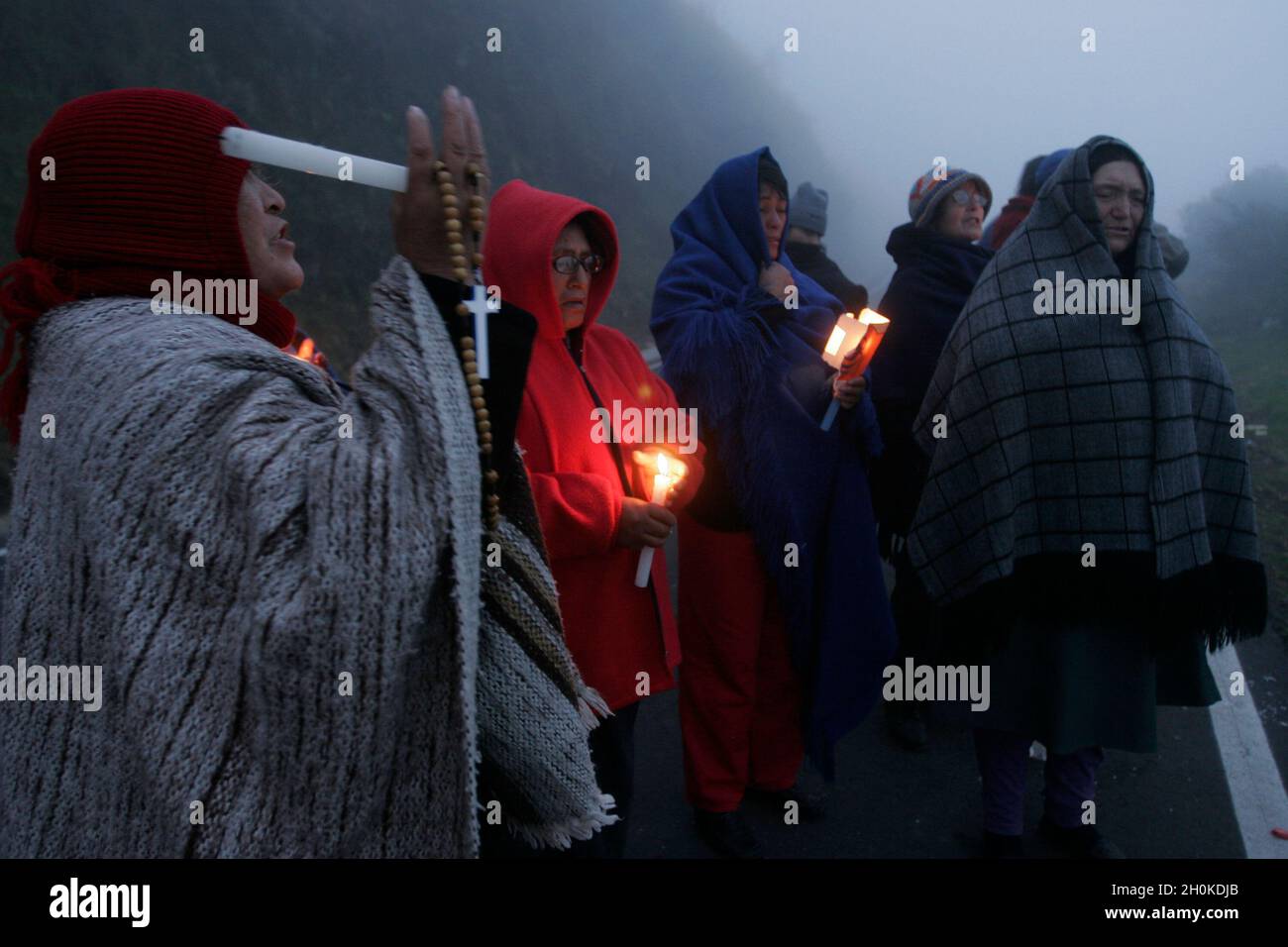 A group of women offering prayer for the victims of a devastating ...