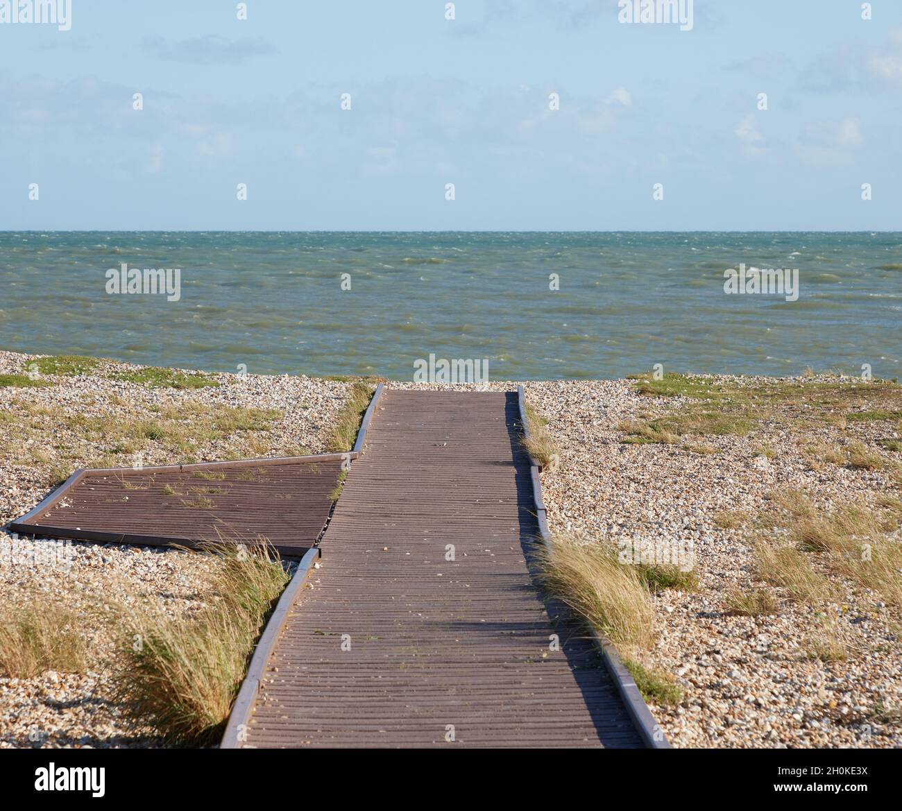 Path running towards the sea om the south coast of the UK Stock Photo ...