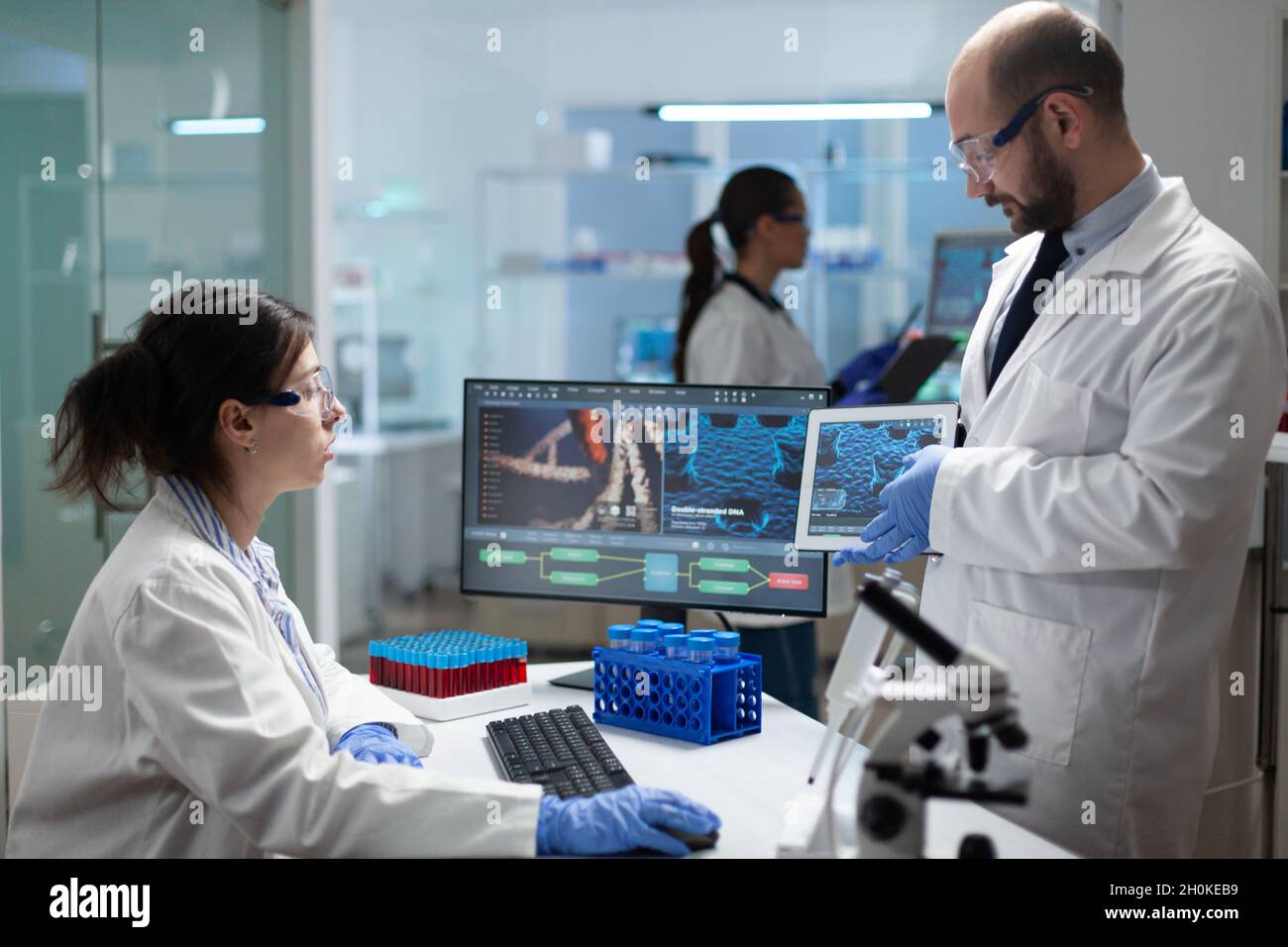 Medical team of biologist researcher working at coronavirus treatment ...