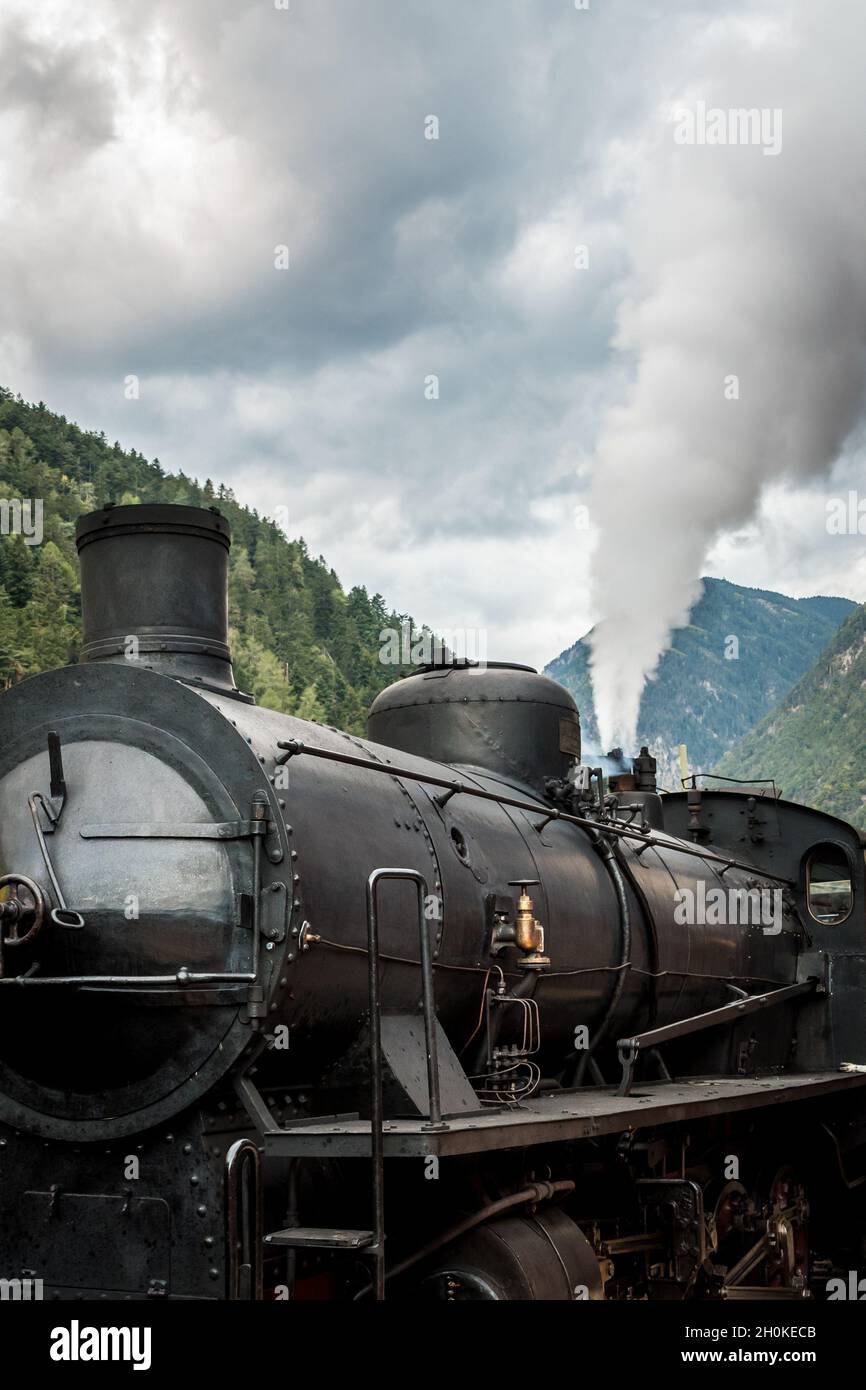 Old fashioned train vagon and Steam locomotive in the station of ...