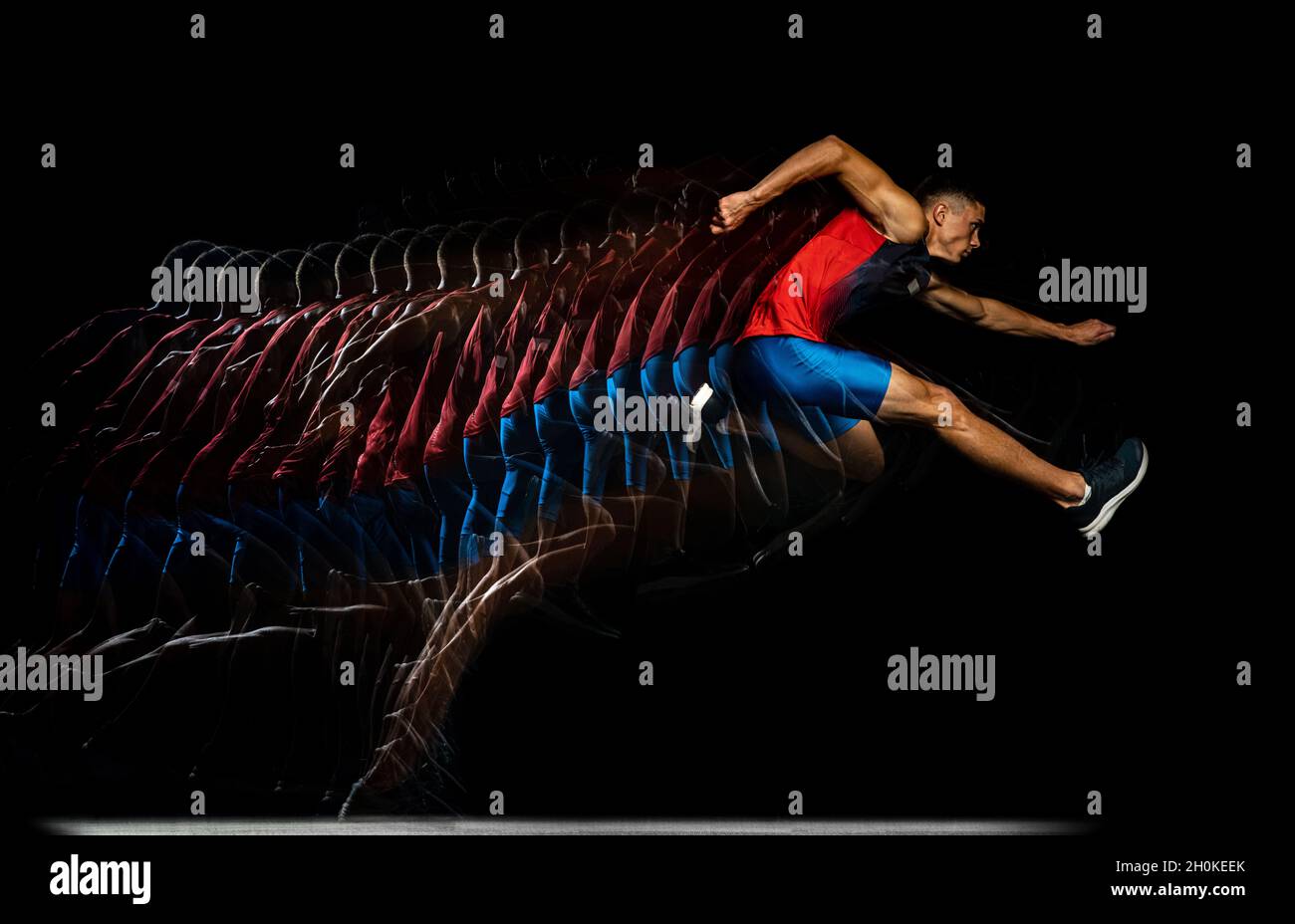 Full-length portrait of young man, professional athlete jumping over ...