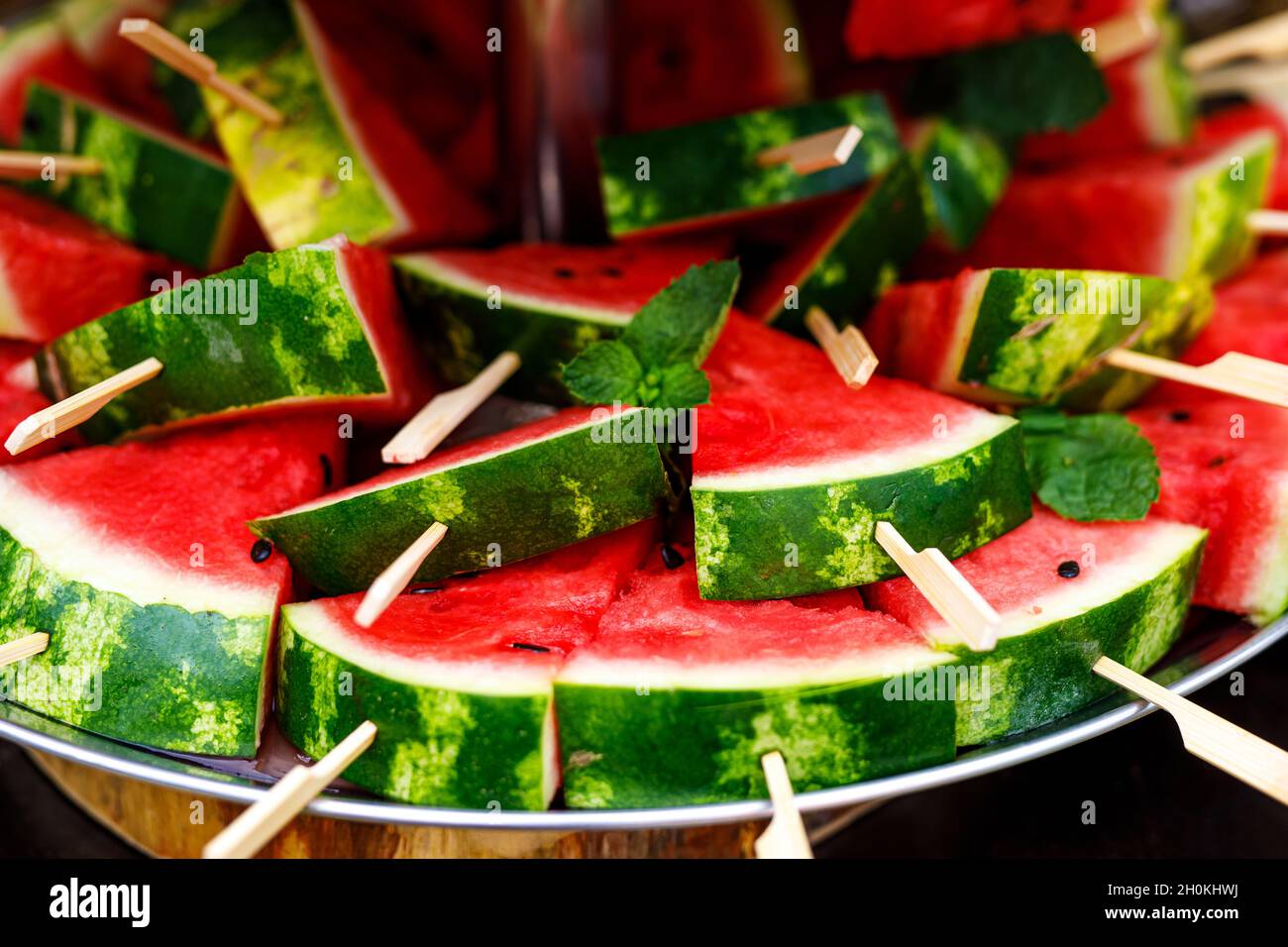 Triangular slices of watermelon. Summer snack Stock Photo - Alamy