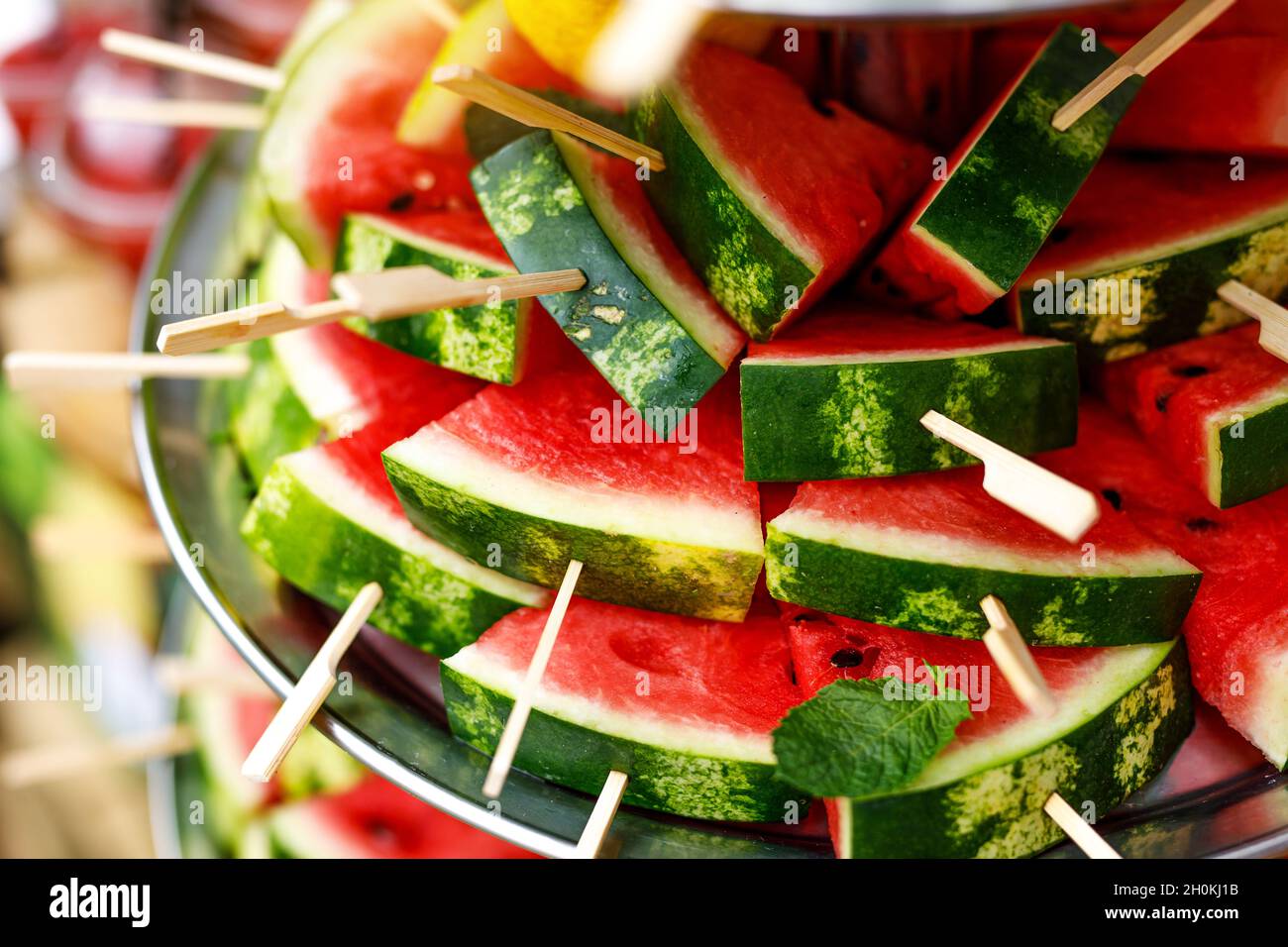 Triangular slices of watermelon. Summer snack Stock Photo - Alamy