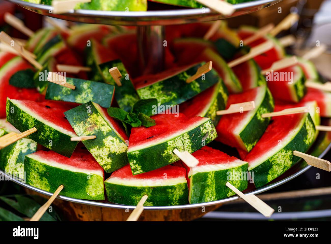 Triangular slices of watermelon. Summer snack Stock Photo - Alamy