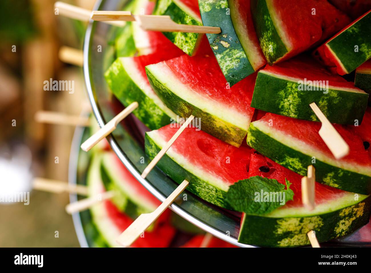 Triangular slices of watermelon. Summer snack Stock Photo - Alamy