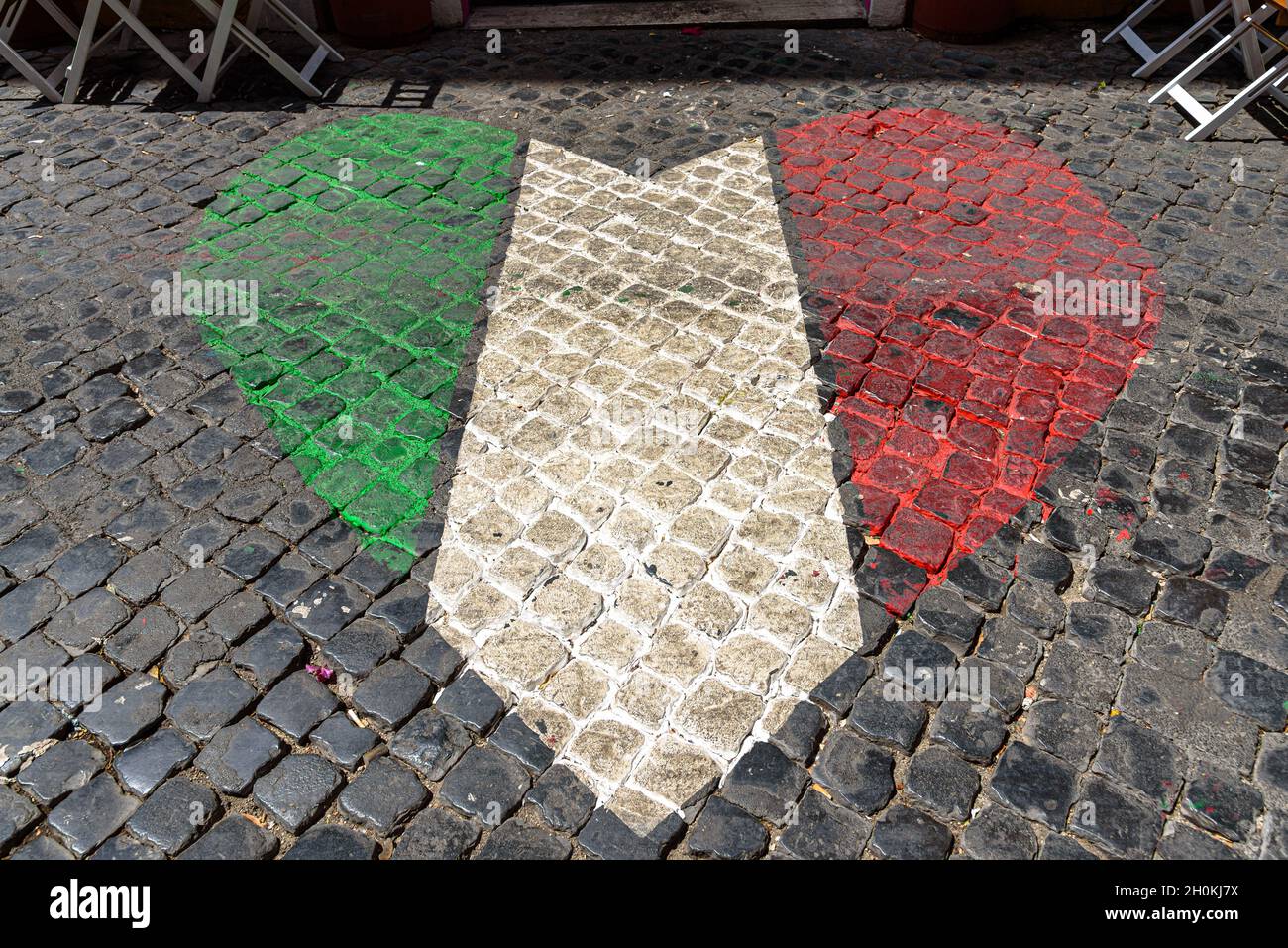 A heart on a cobblestone street in Trastevere, Rome in the colours of ...