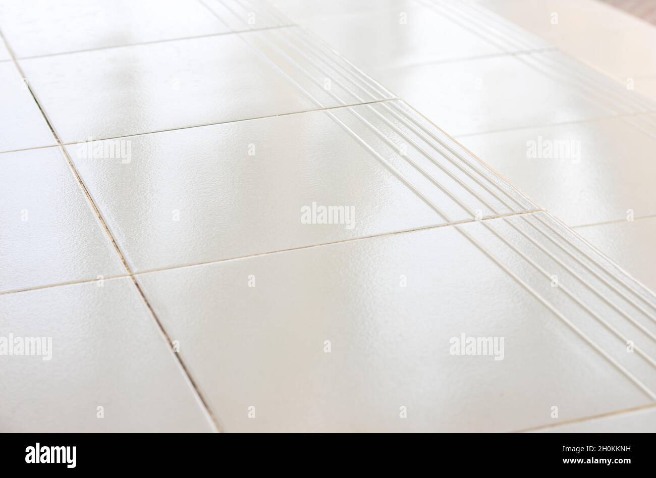 White tiles floor perspective view with selective focus Stock Photo - Alamy