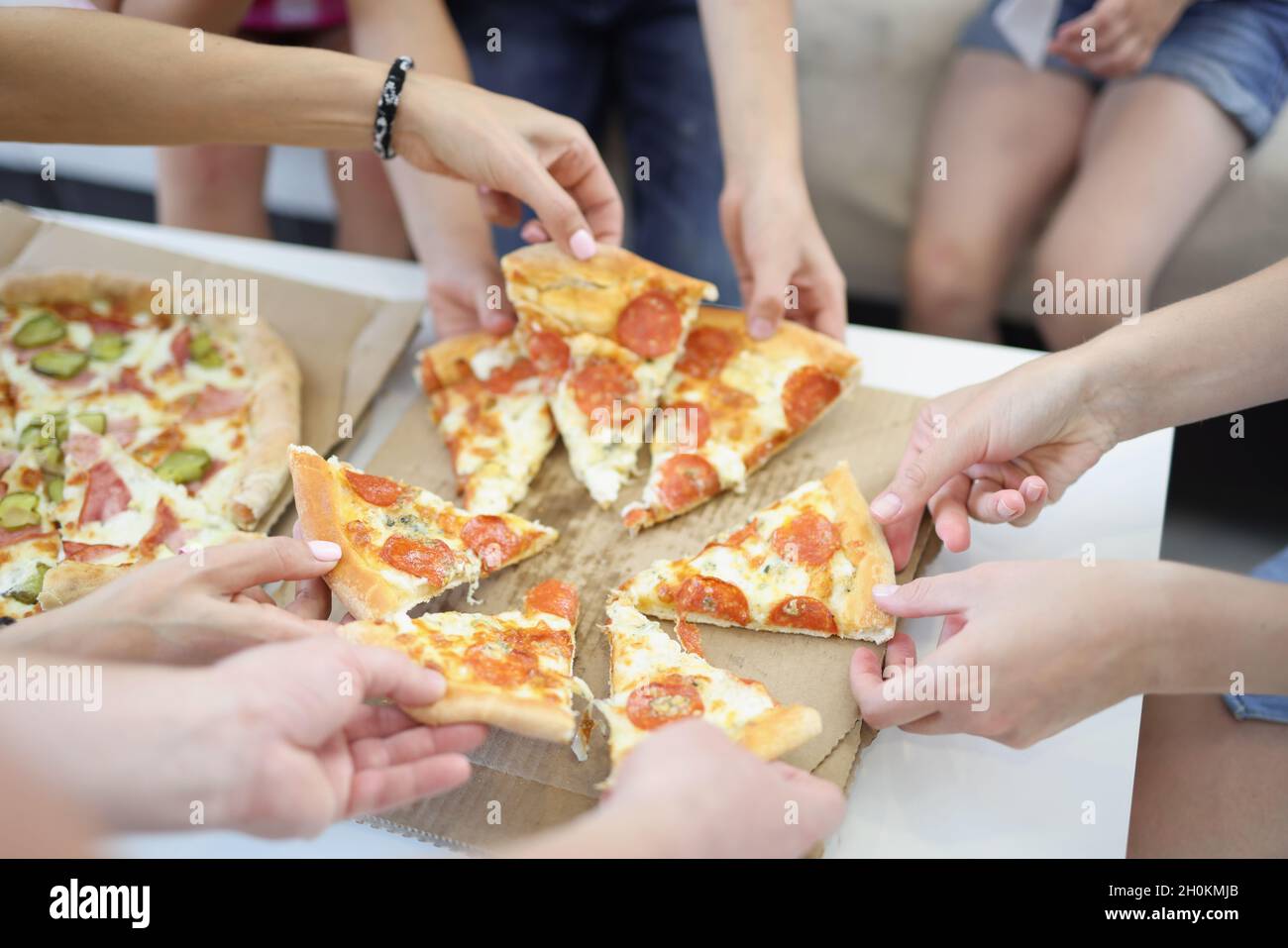 Grabbing slices hi-res stock photography and images - Alamy