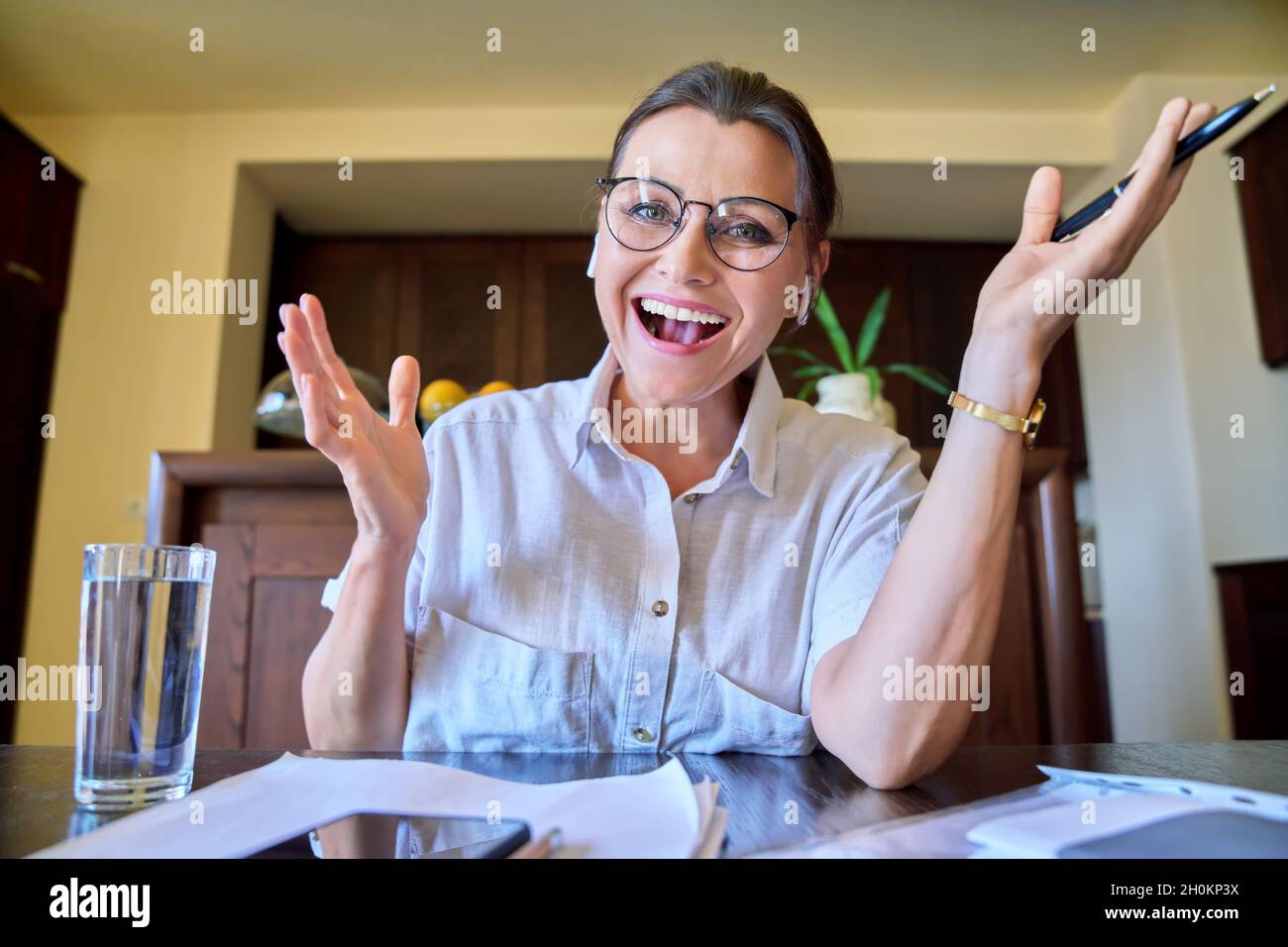 Female psychologist, psychiatrist in headphones looking at webcam ...