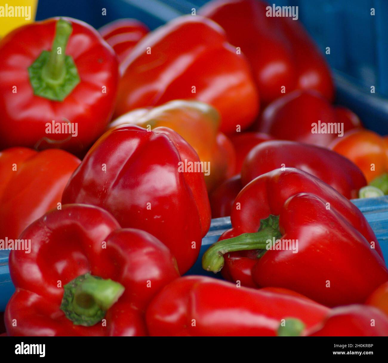 Fresh red bell peppers at a grocery store Stock Photo - Alamy