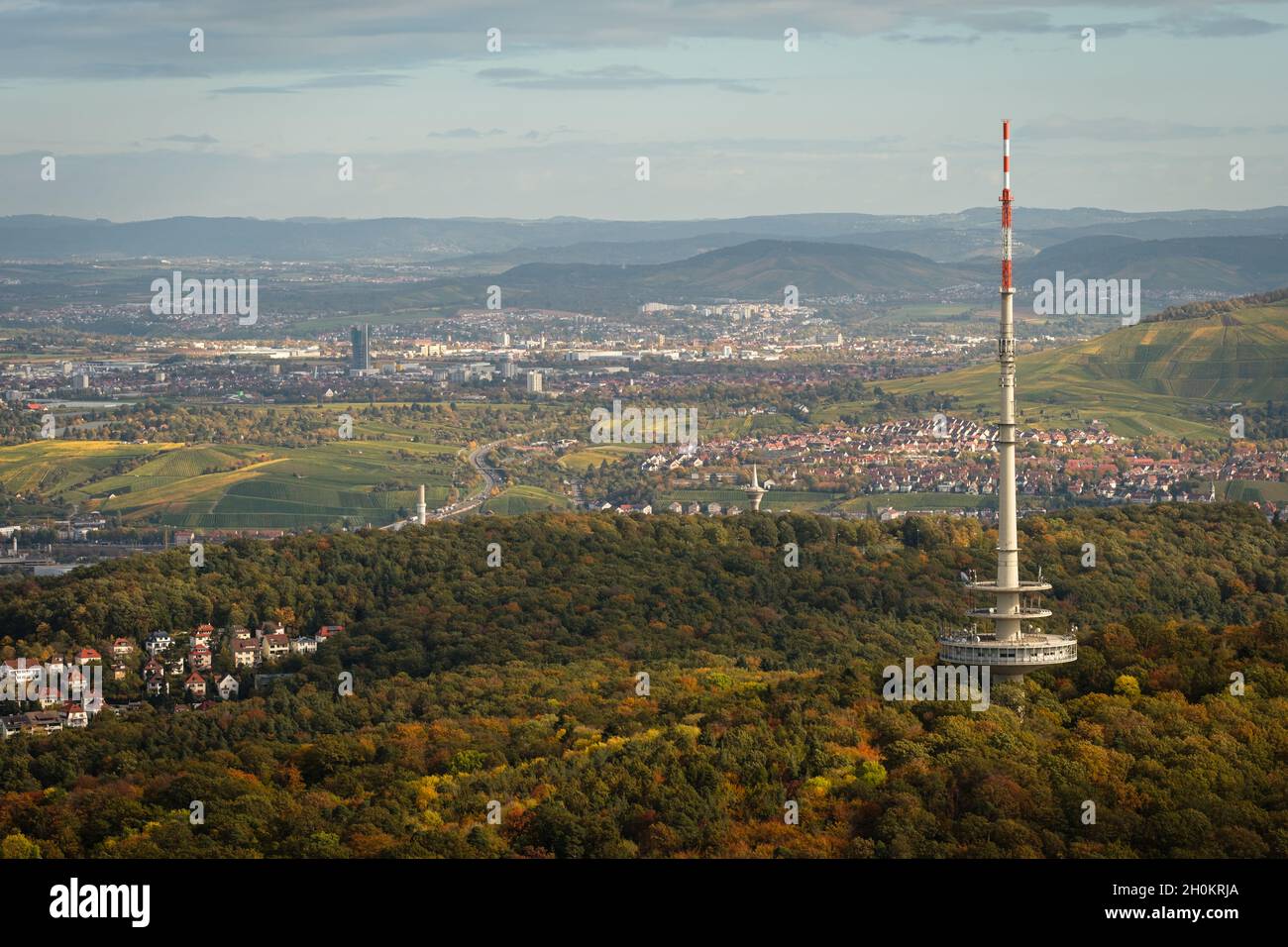 Aerial of the Stuttgart telecommunications tower on the green mountains ...