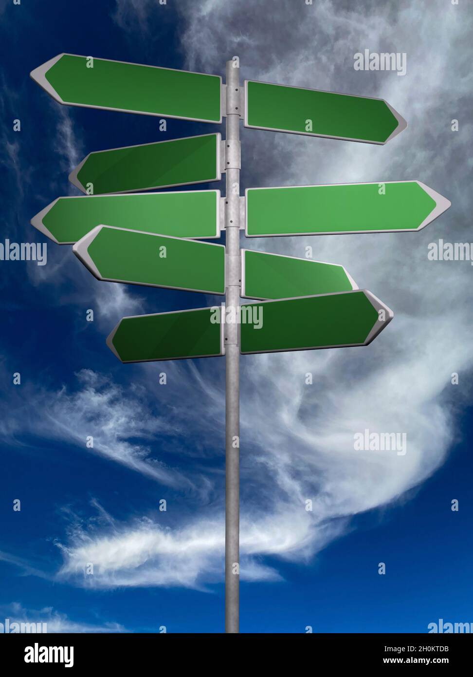 green directionl signs on a blue sky background Stock Photo - Alamy