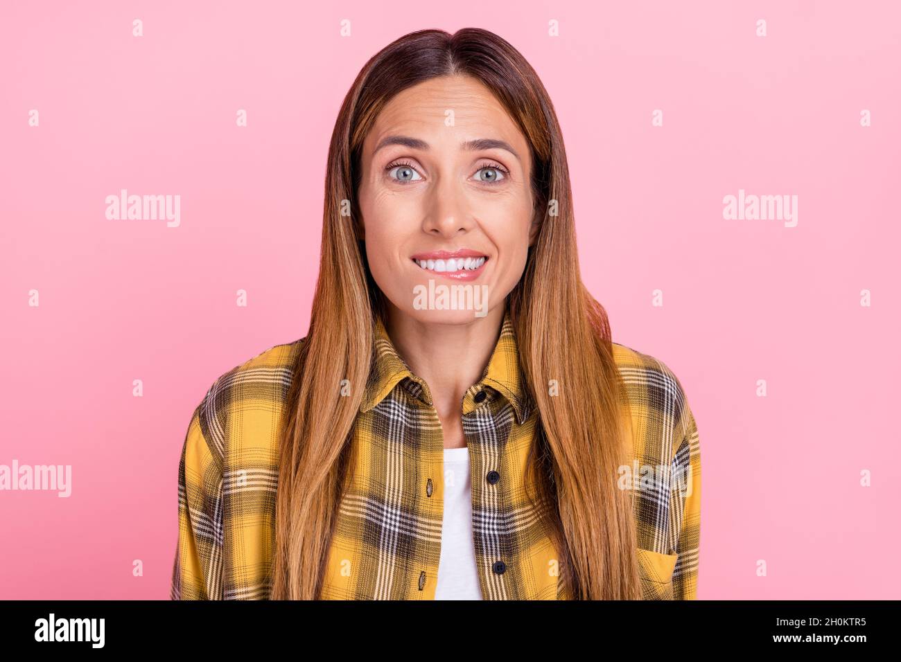 Photo of unhappy upset young woman bite lips teeth dilemma puzzled ...