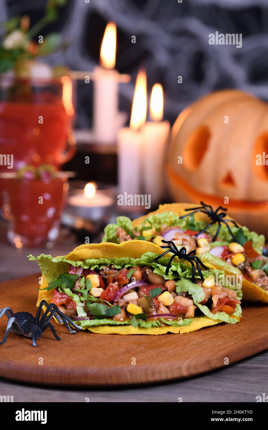 Halloween Food. Mexican corn tortilla tacos with vegetables and chicken ...